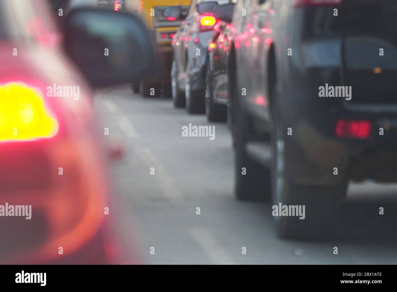 Cars standing in a traffic jam on a city street Stock Photo - Alamy