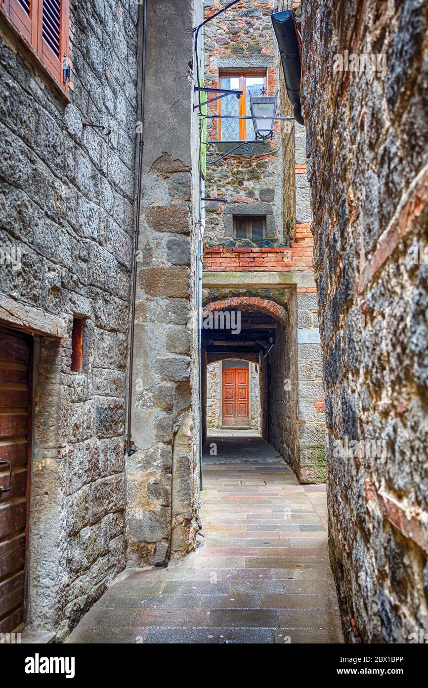 Narrow alley between houses in an old town Stock Photo - Alamy