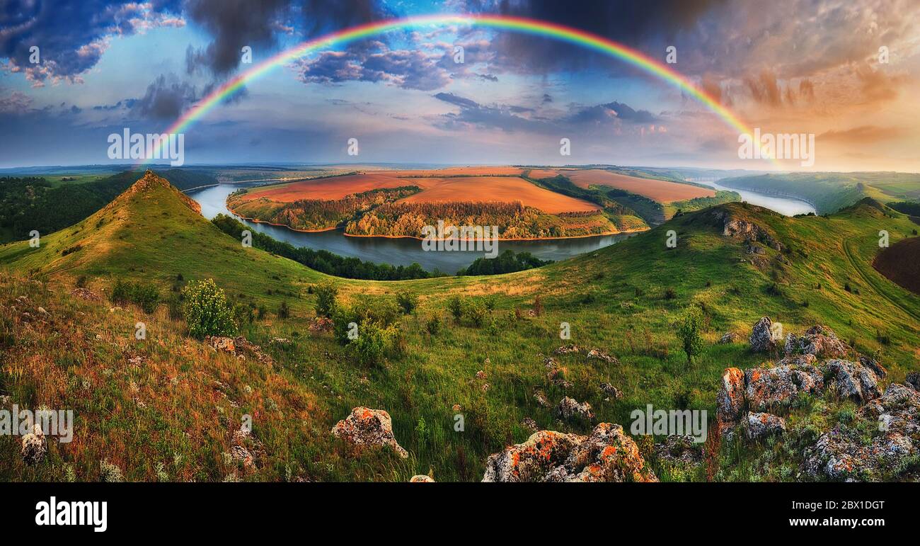 colorful rainbow over river canyon Stock Photo - Alamy