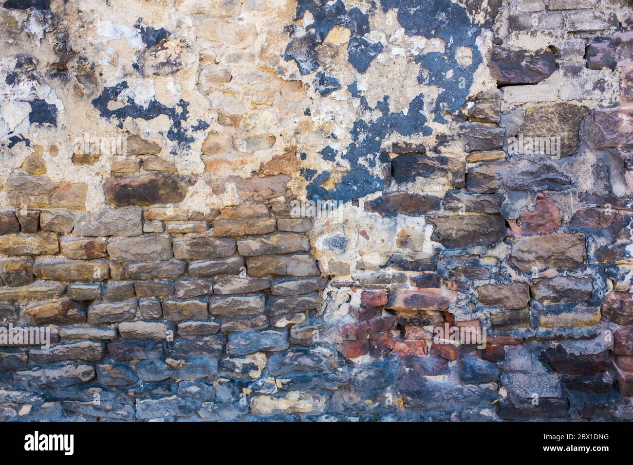 Detail shot of an old brick wall and crumbling cement Stock Photo - Alamy