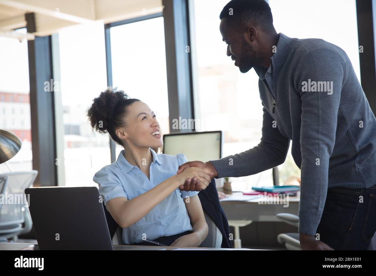 Business people shaking their hands Stock Photo - Alamy