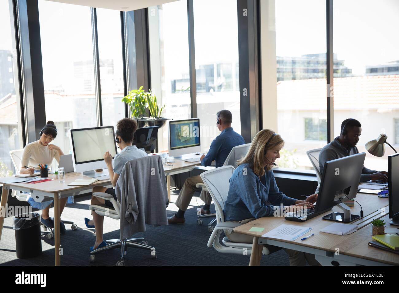 Working in modern office customer hi-res stock photography and images ...