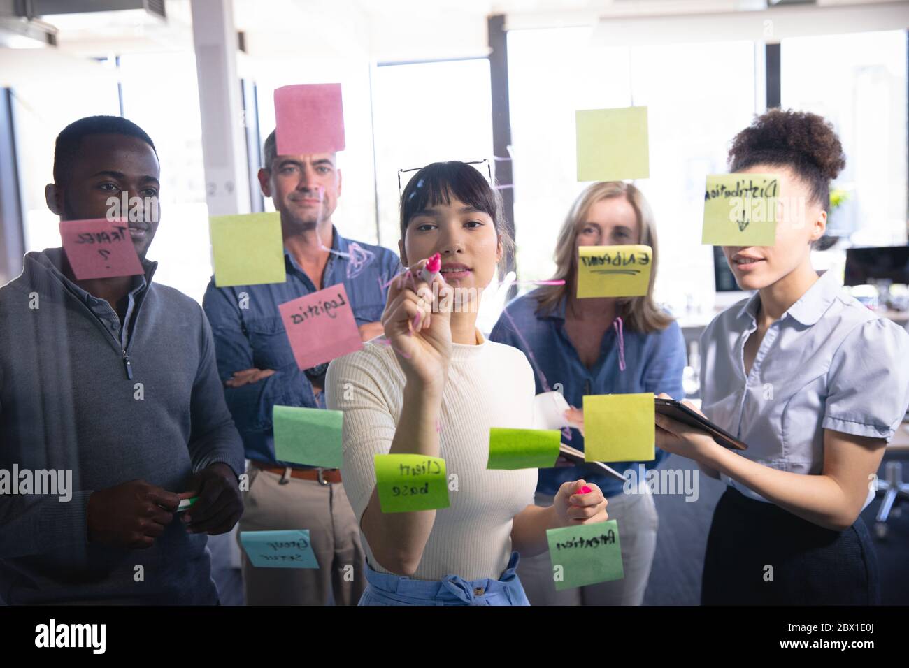 Business people co-working in office Using post it board Stock Photo ...