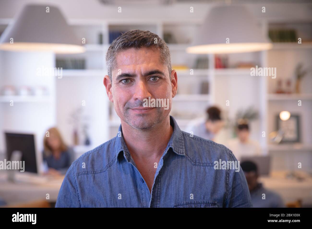 Caucasian business man In open space looking at camera Stock Photo - Alamy