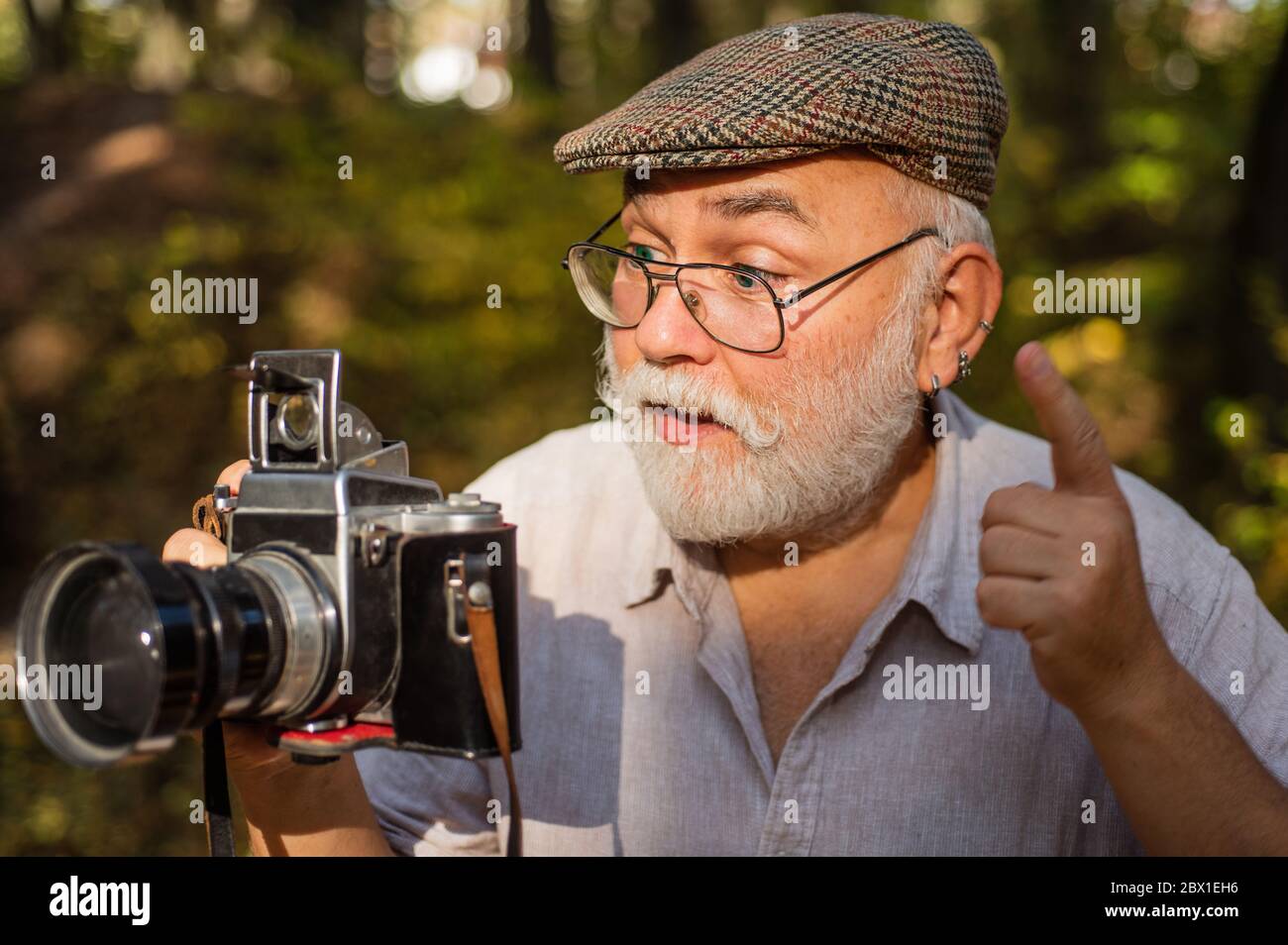 Make perfect frame. Landscape nature photo. Old photographer filming ...