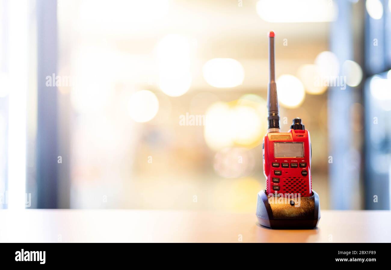 A red Walkie Talkie or Portable radio transceiver for communication ...