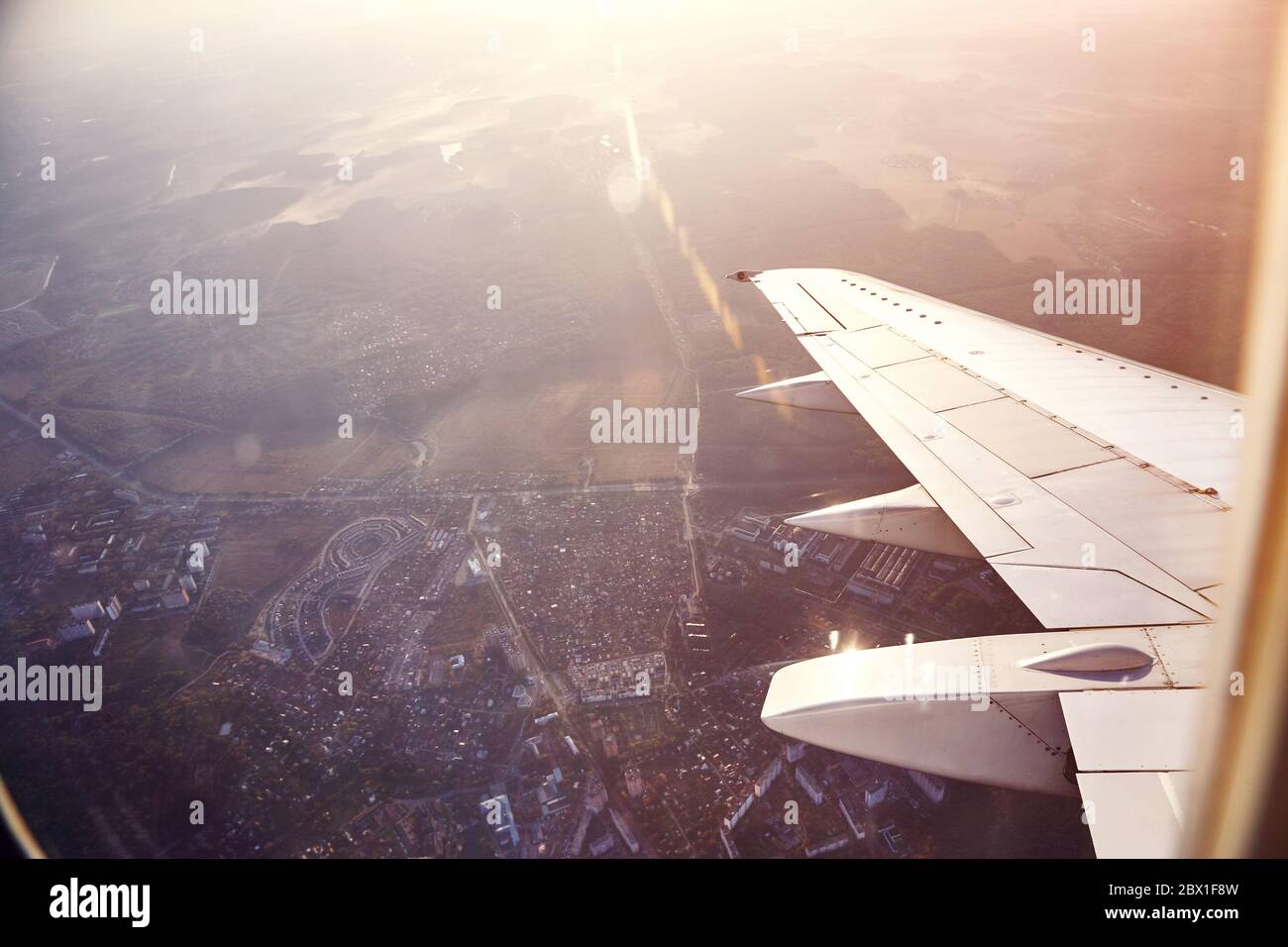 view from an airplane window down to the ground Stock Photo - Alamy