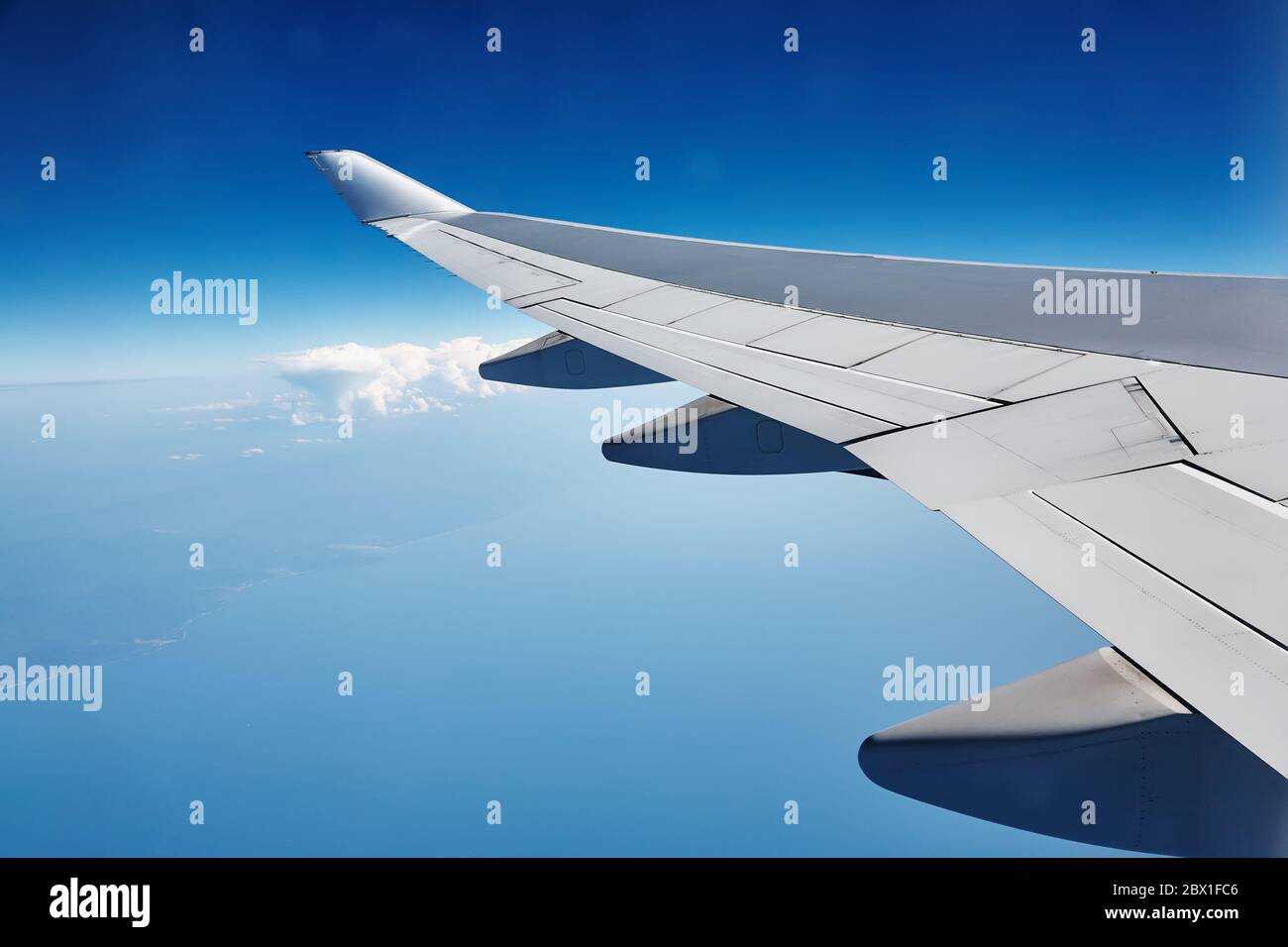 view from an airplane window down to the ground Stock Photo - Alamy