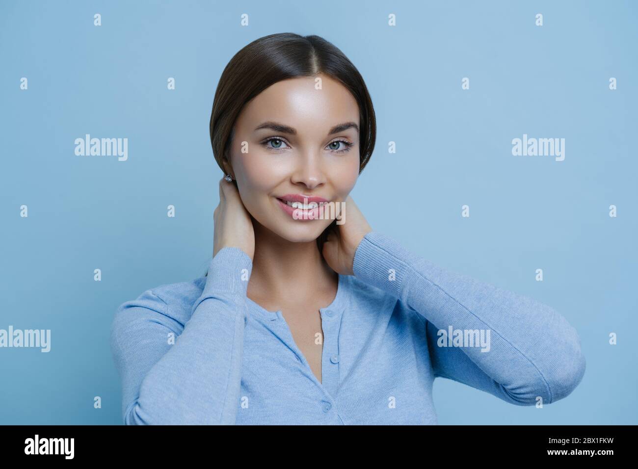 Attractive stylish young female model has calm cheerful alluring ...