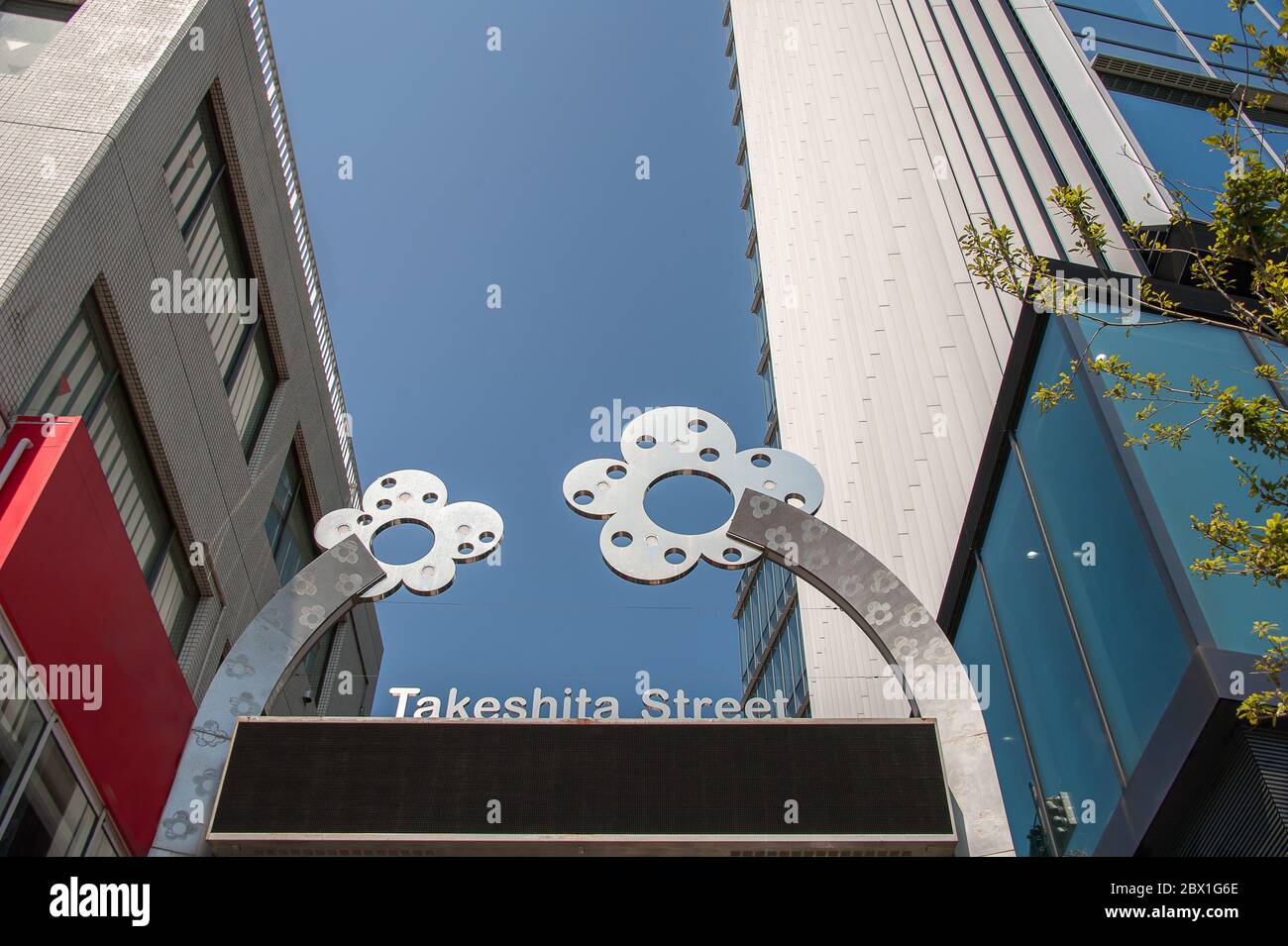 Street sign against blue sky, Harajuku, Japan. Takeshita Street is a ...