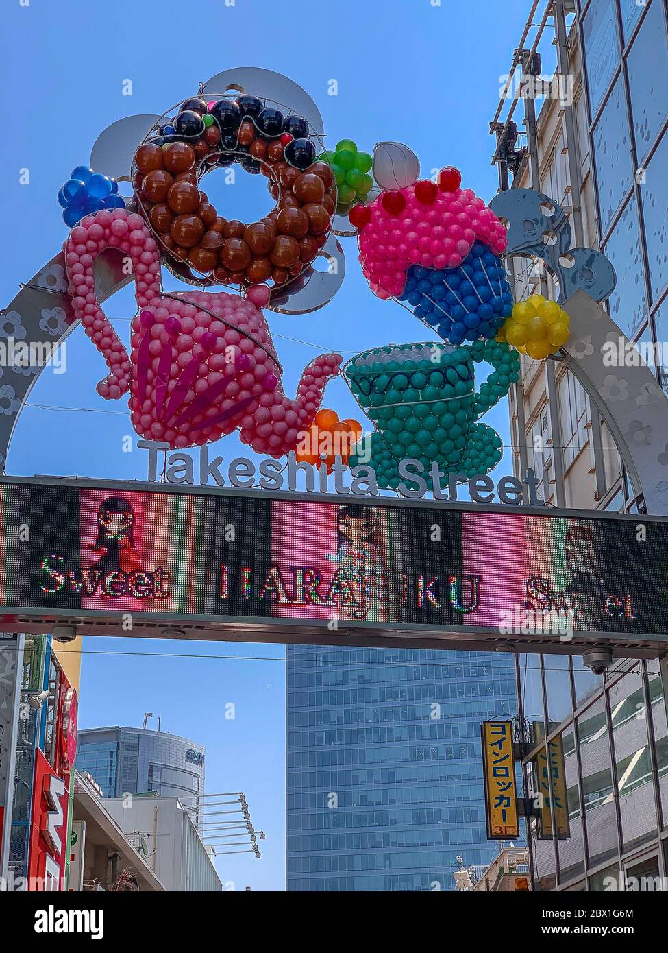 Street sign against blue sky, Harajuku, Japan. Takeshita Street is a ...