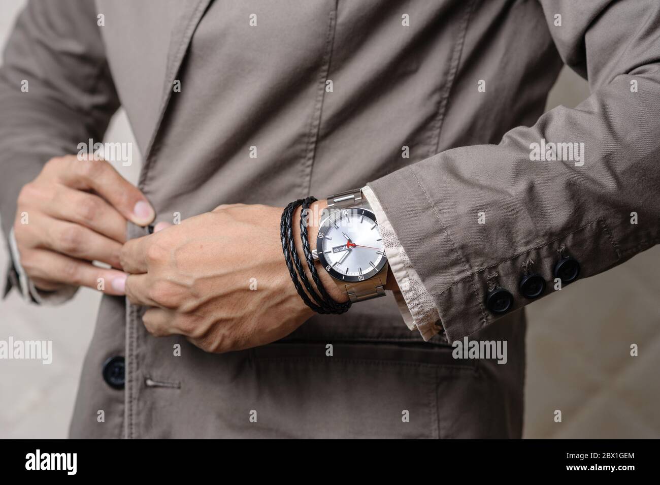 Mans wrist with bracelets hi-res stock photography and images - Alamy