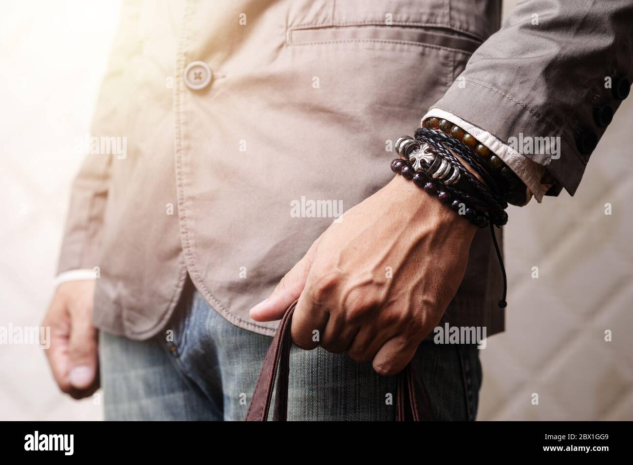 Mans wrist with bracelets hi-res stock photography and images - Alamy