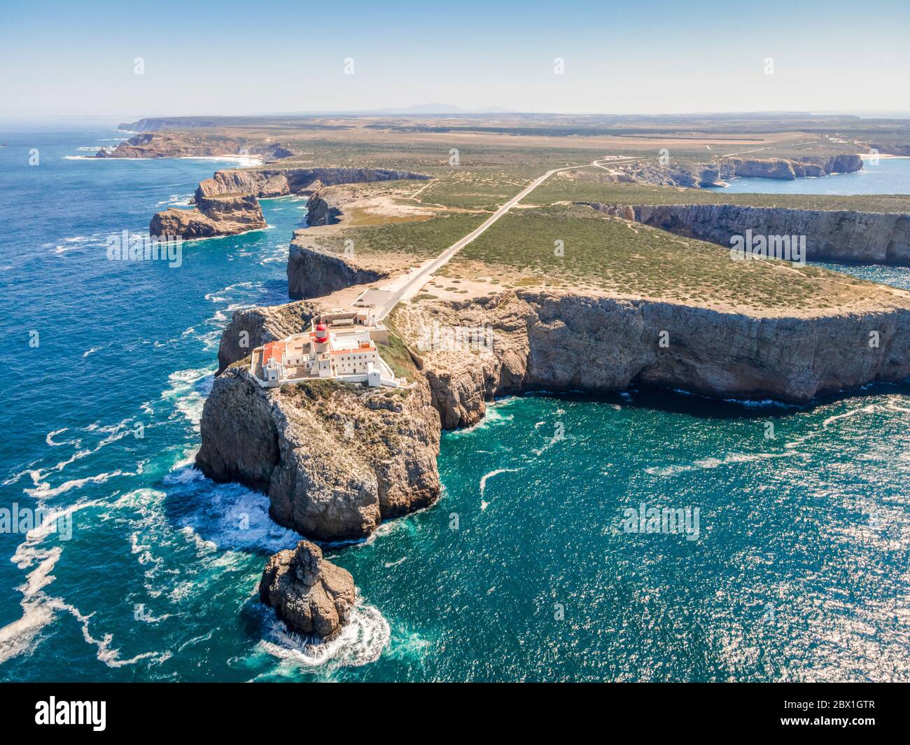 Beautiful lighthouse located on high cliffs of Saint Vincent cape in ...
