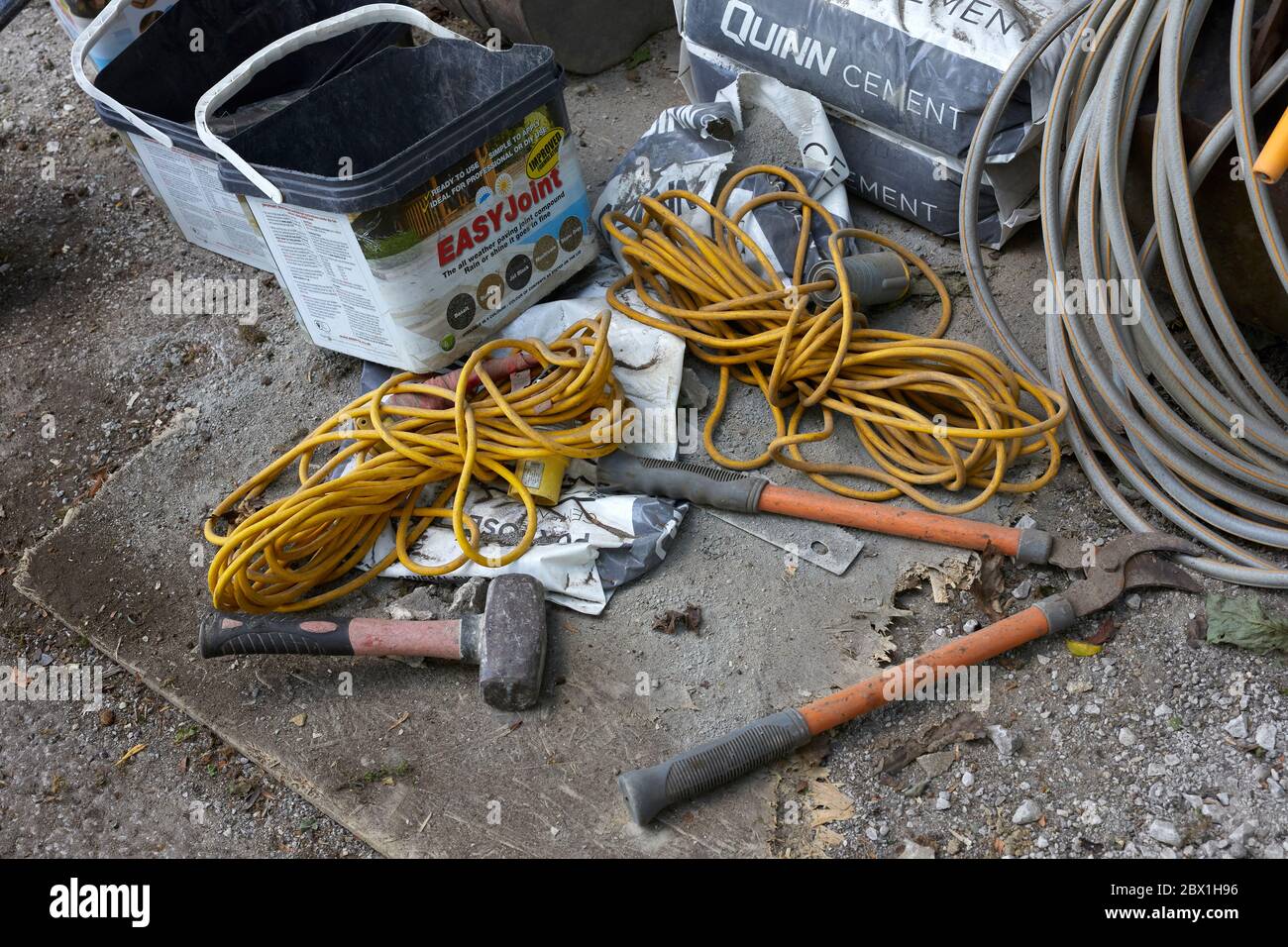 Work tools and equipment used during rock breaking landscaping during ...