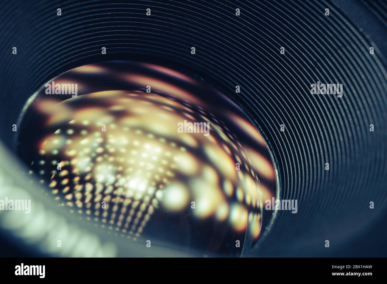 Beautiful Camera Lens on a dark with yellow shine reflection light ...