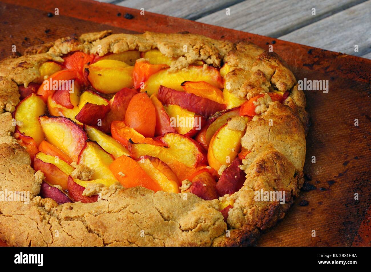 Homemade rustic galette pastry with fresh peaches and apricots Stock ...