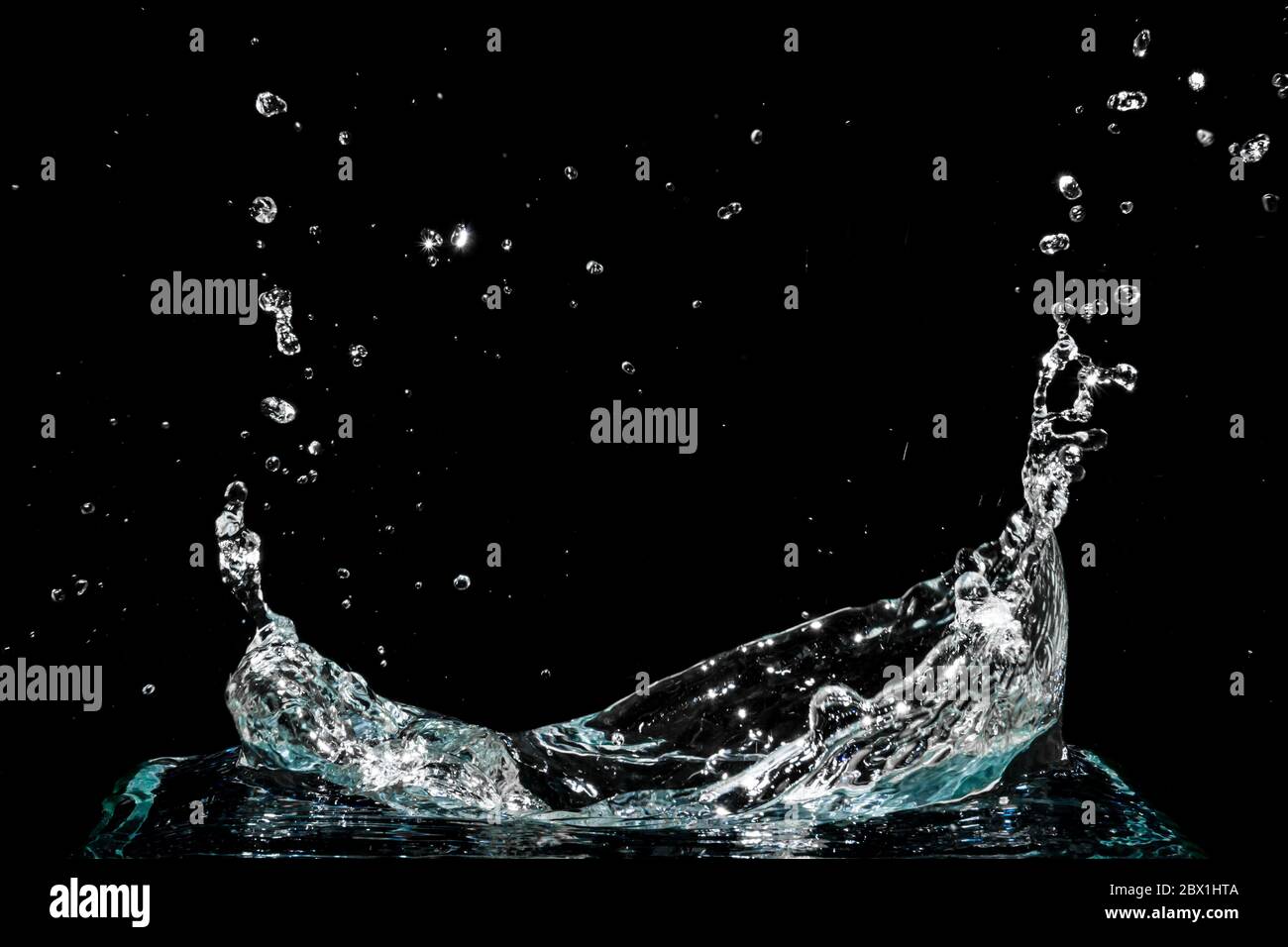 Water splash isolated on black background Stock Photo - Alamy