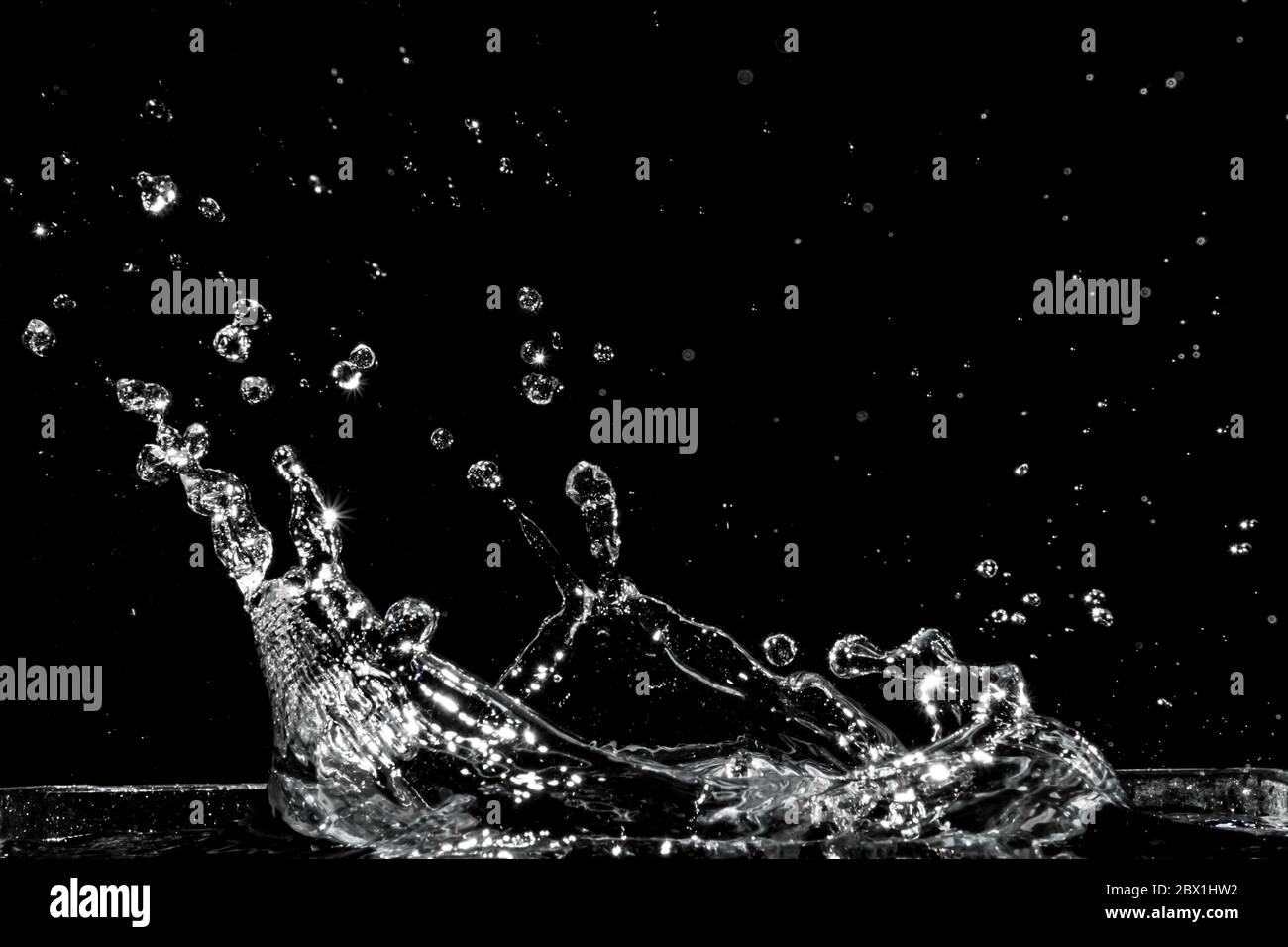 Water splash isolated on black background Stock Photo - Alamy