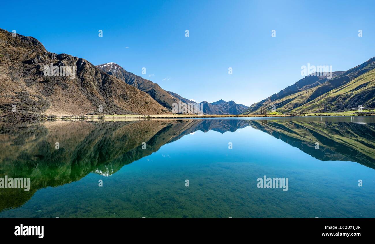 Panorama, mountains reflecting in lake, Moke Lake near Queenstown ...
