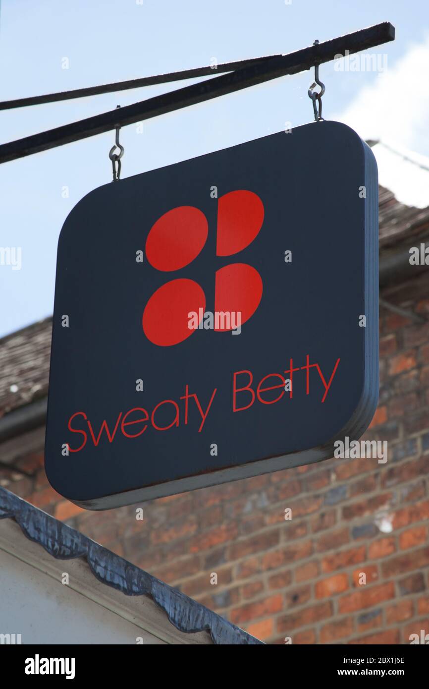 The Sweaty Betty sign hanging from a shop in the UK Stock Photo - Alamy