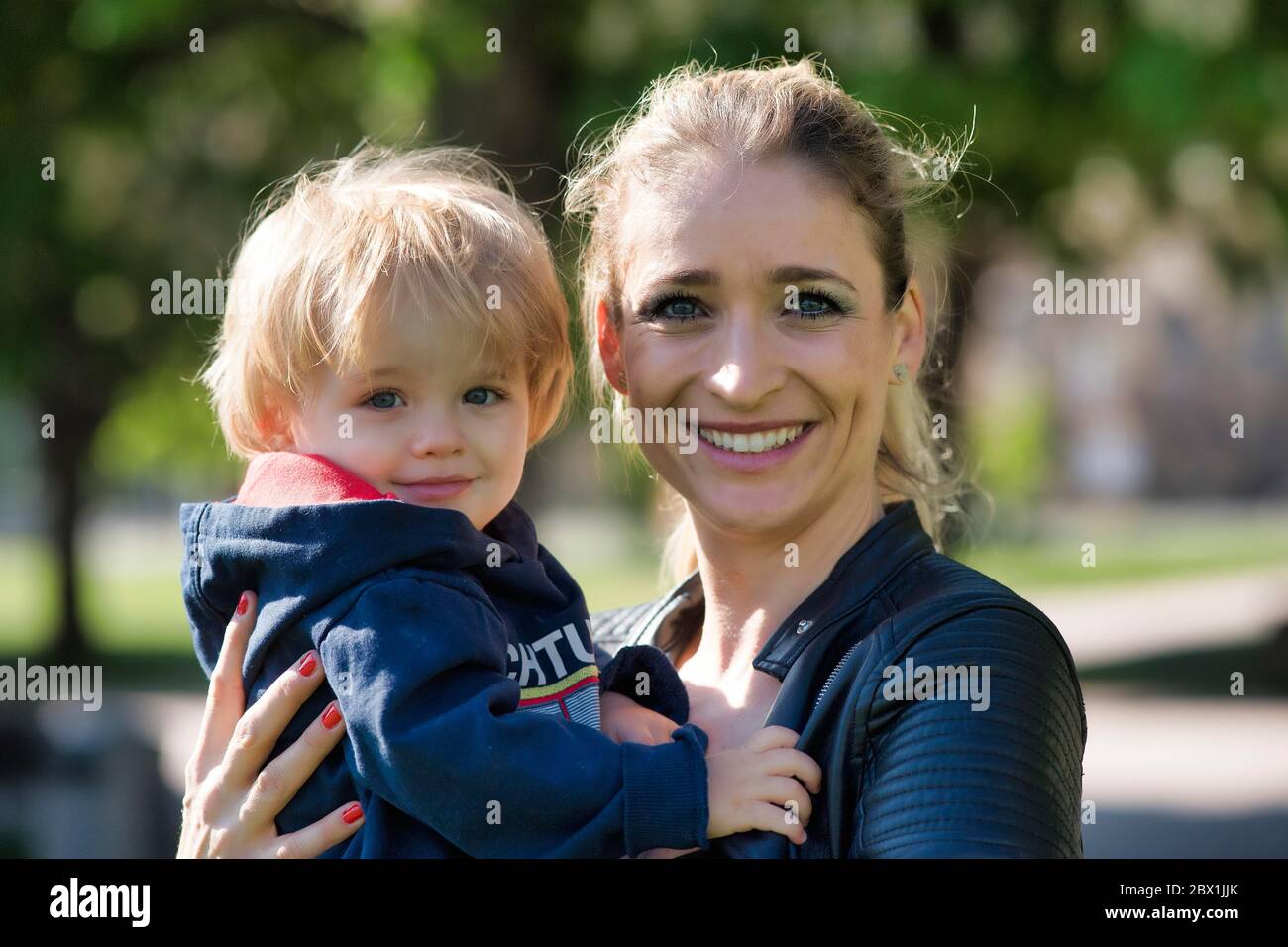 Mother holding son, 18 months, Baden-Wuerttemberg, Germany Stock Photo ...