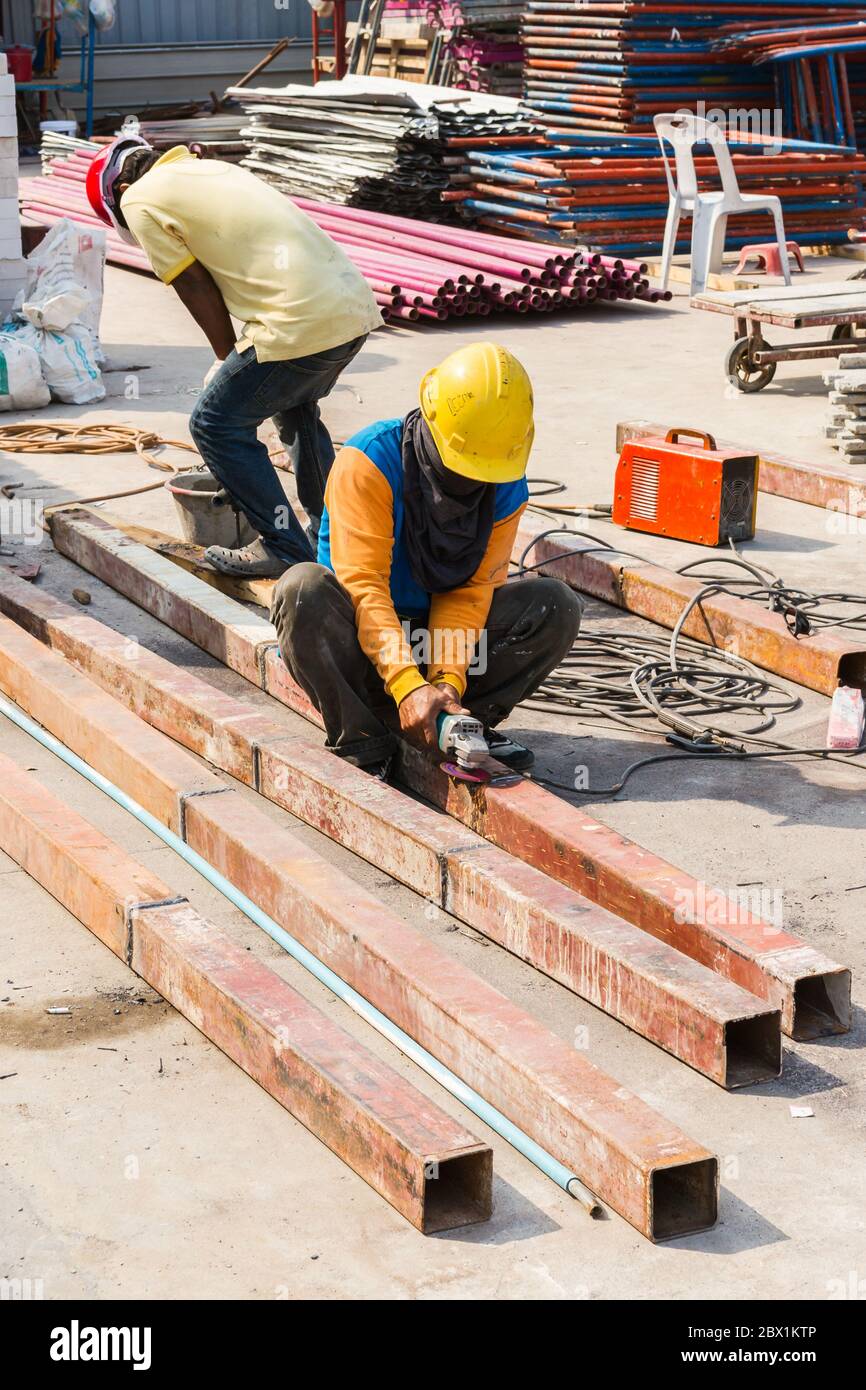 Steel Workers welding, grinding, cutting in metal industry Stock Photo ...