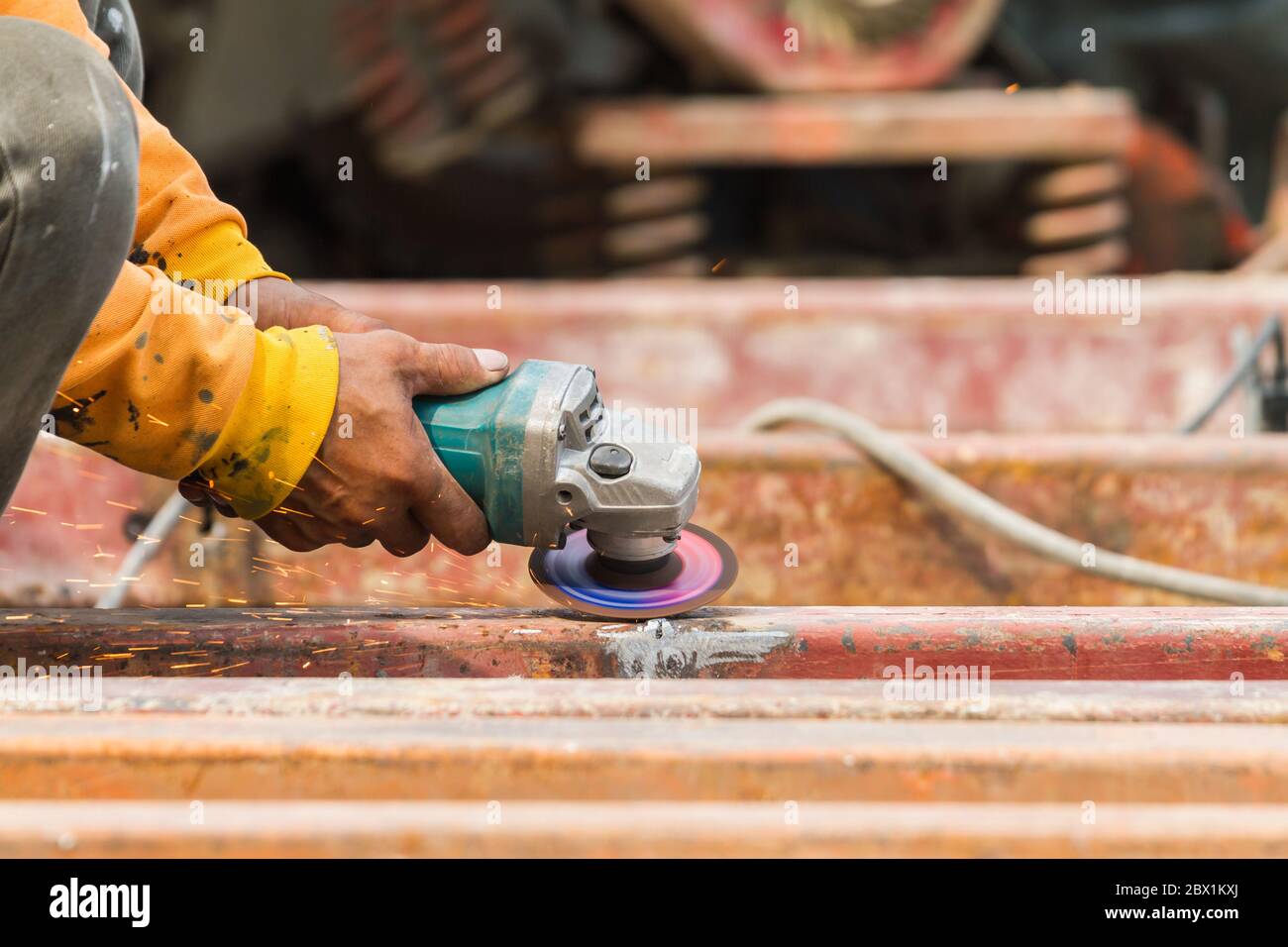 Steel Workers welding, grinding, cutting in metal industry Stock Photo ...