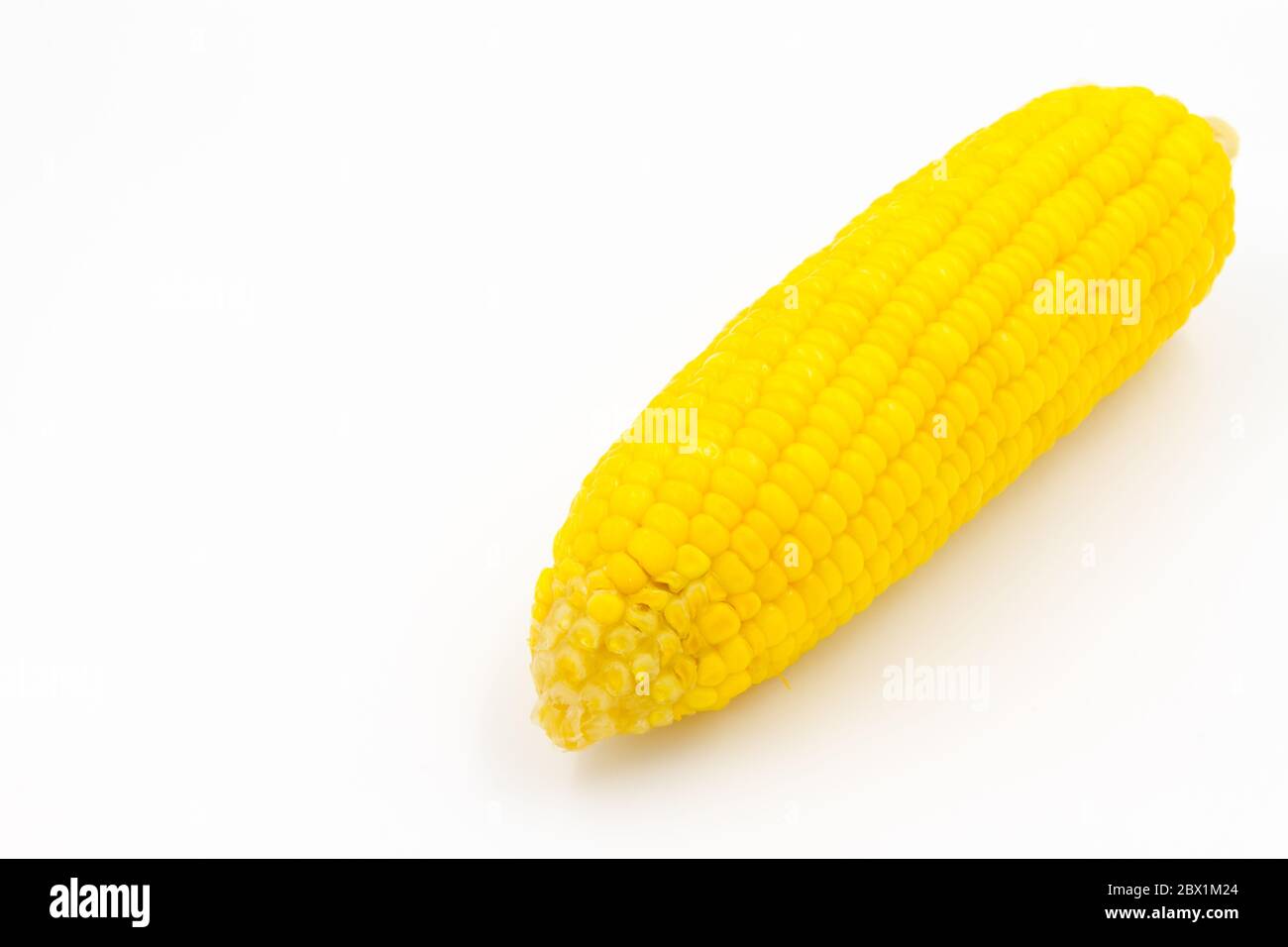 Boiled corn on white background Stock Photo - Alamy