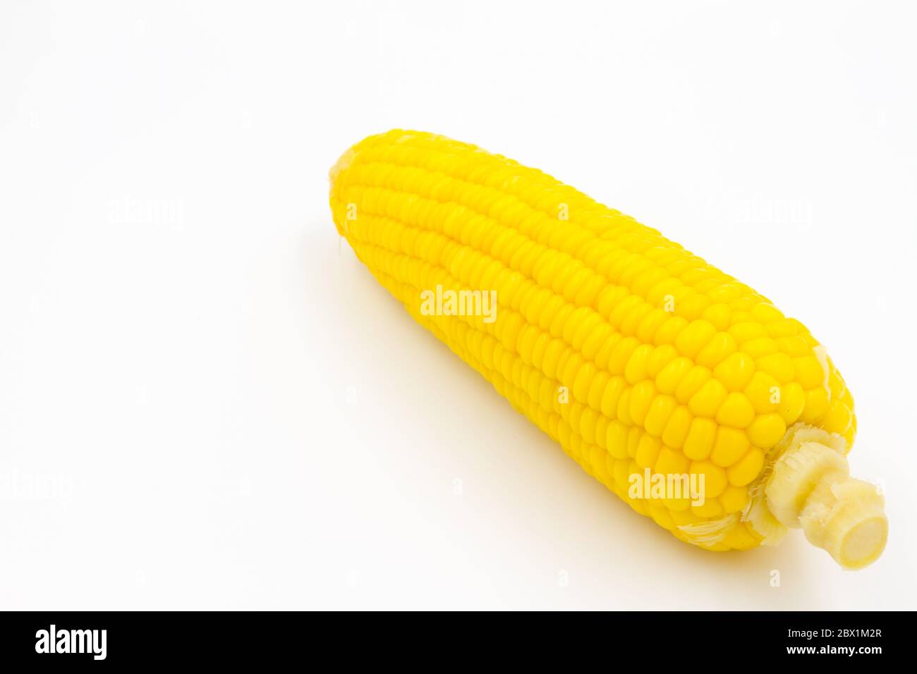 Boiled corn on white background Stock Photo - Alamy