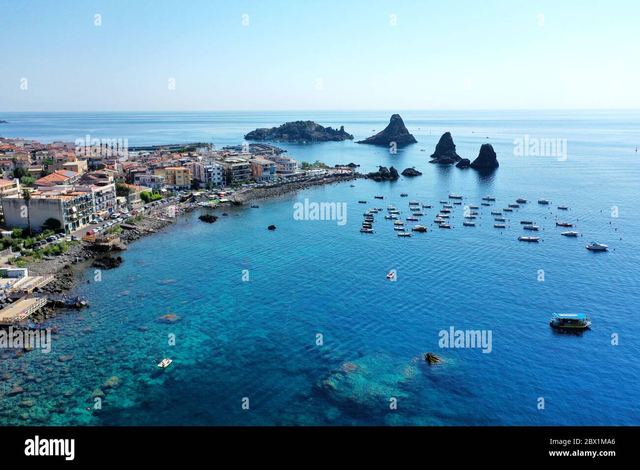 Acitrezza sea and Faraglioni cliff Stock Photo - Alamy
