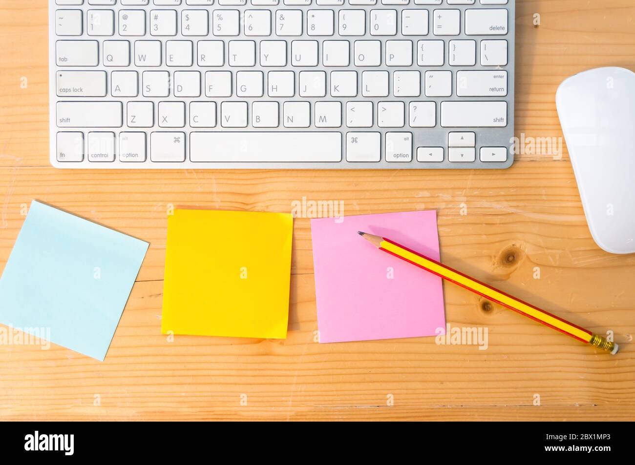 Top view workspace with colorful sticky notes ,pencil, keyboard and ...