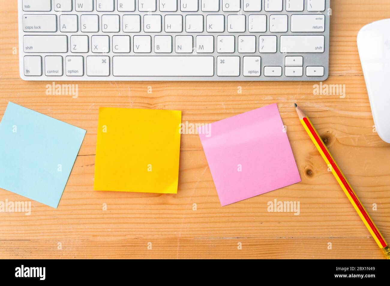 Top view workspace with colorful sticky notes ,pencil, keyboard and ...