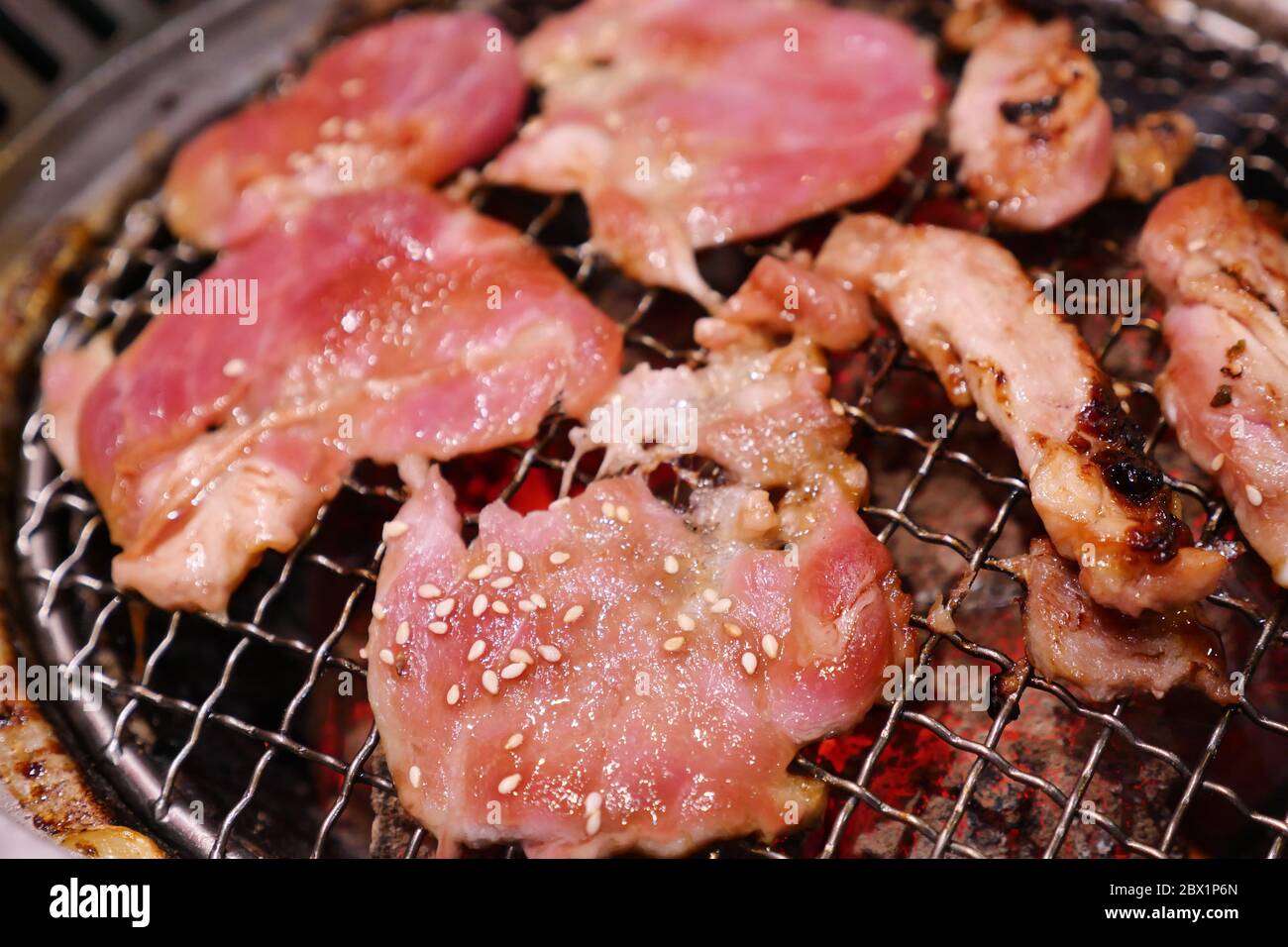 Pork grill on hot coals. This kind of food is a Korean or Japanese BBQ ...