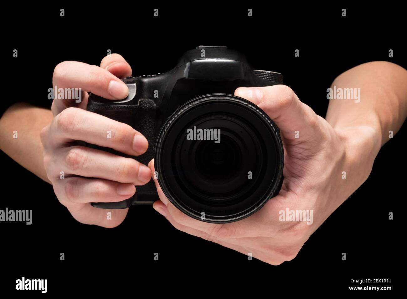 Male hand holding a digital camera on a black background Stock Photo ...