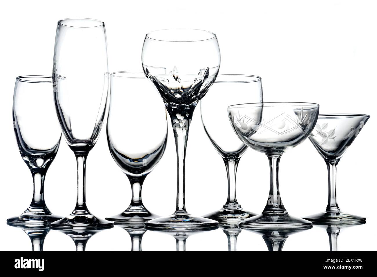 Collage of empty glasses on white background Stock Photo - Alamy
