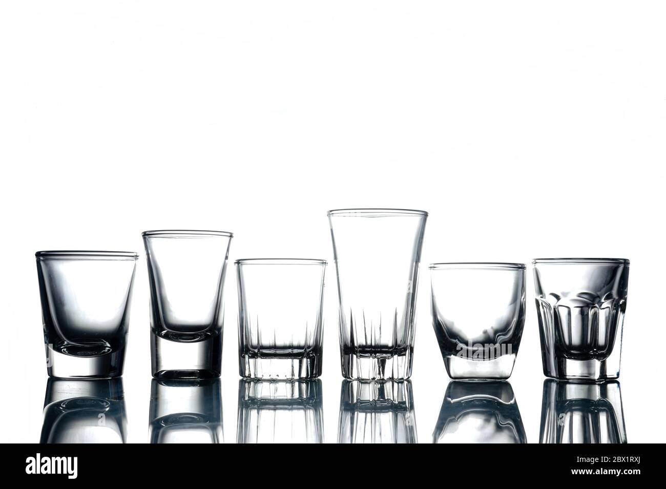 Collage of empty glasses on white background Stock Photo - Alamy