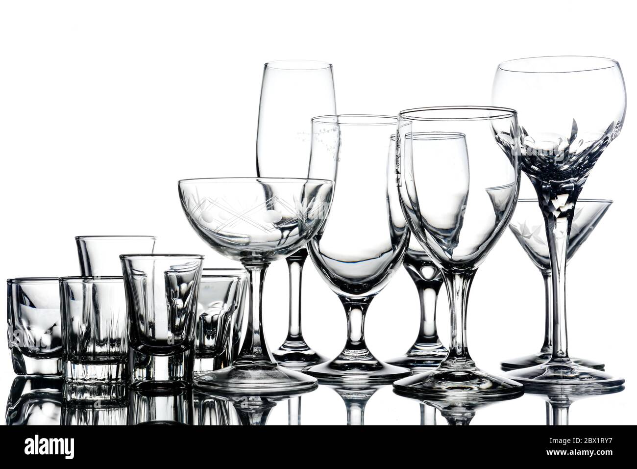Collage of empty glasses on white background Stock Photo - Alamy