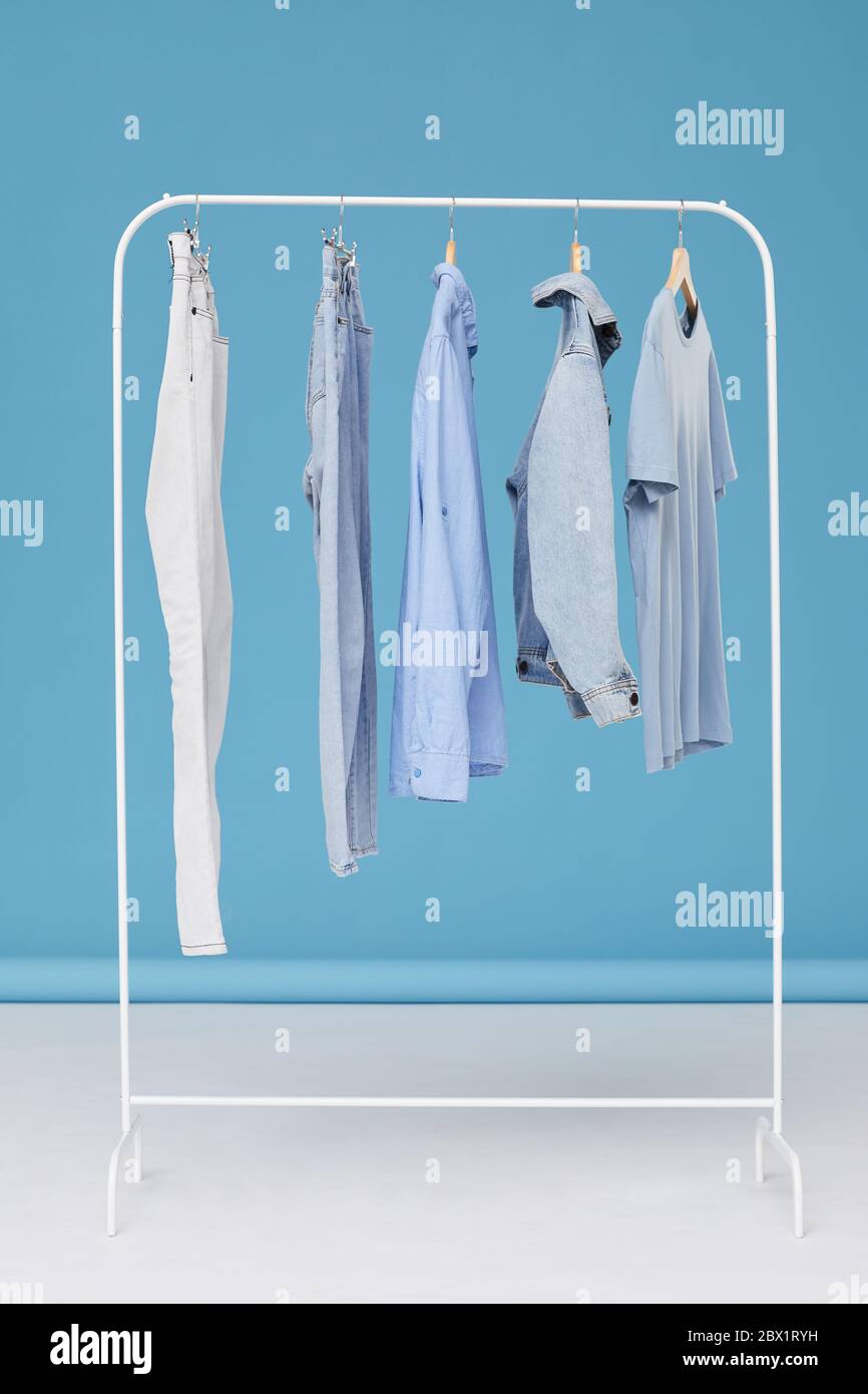 Image of jeans clothes hanging on hanger in the clothes shop Stock ...