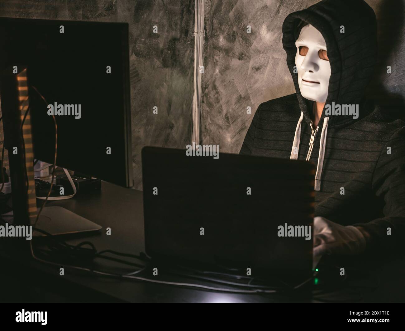 Computer hacker - Man in hoodie shirt with mask stealing data from ...