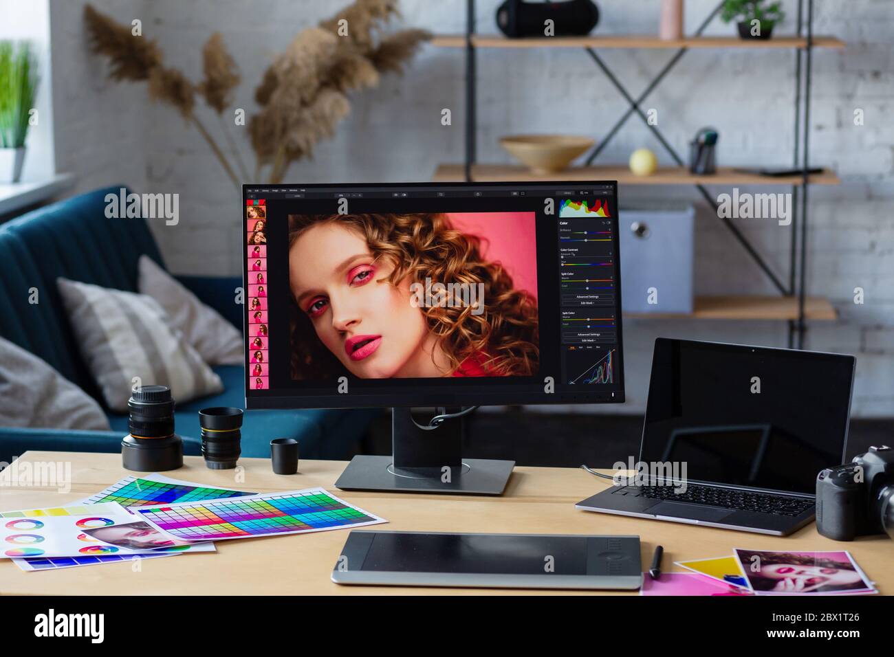 Graphic designer workplace in photo studio. Camera, graphic drawing ...