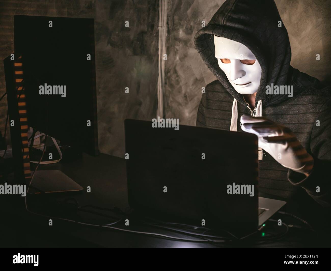Computer hacker - Man in hoodie shirt with mask stealing data from ...