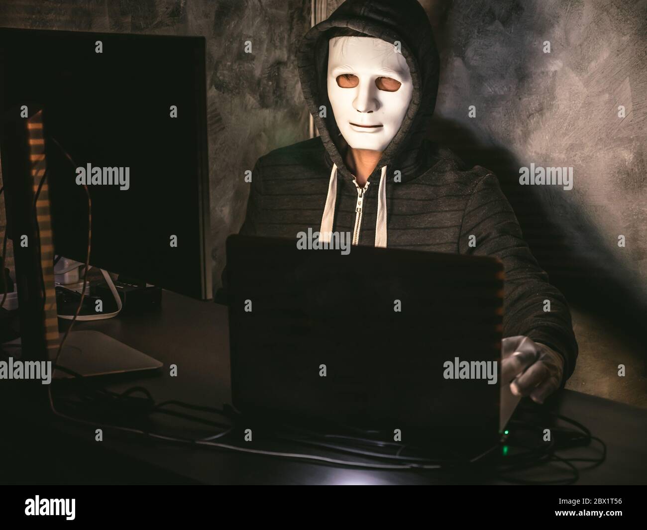 Computer hacker - Man in hoodie shirt with mask stealing data from ...