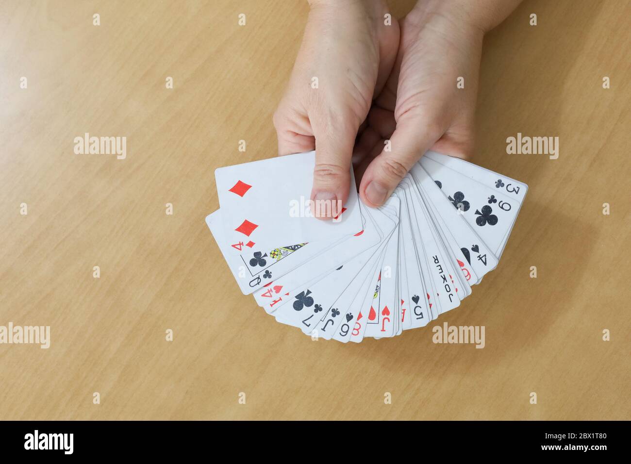 Hands hold a deck of playing cards Stock Photo - Alamy
