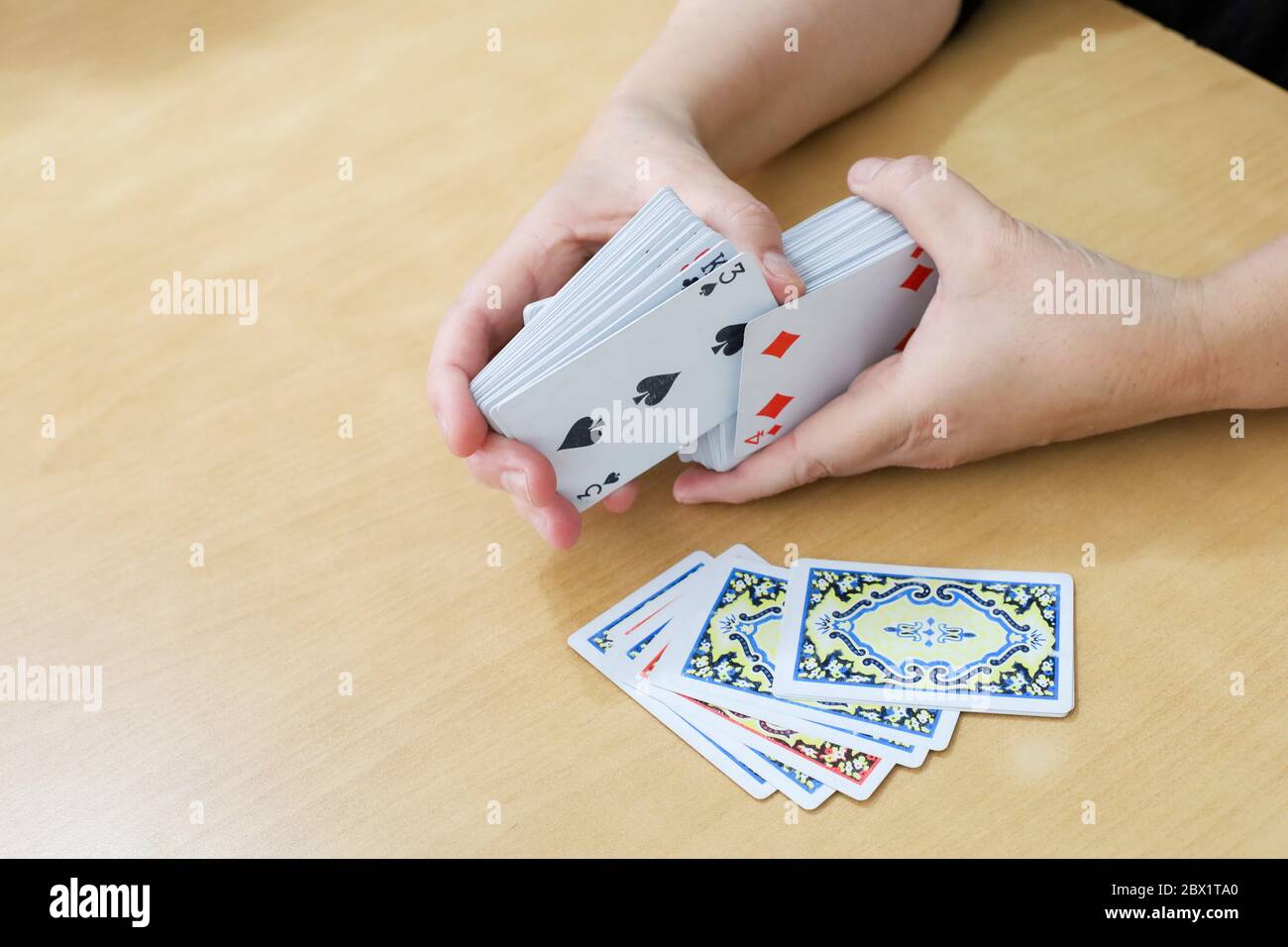 Hands hold a deck of playing cards Stock Photo - Alamy