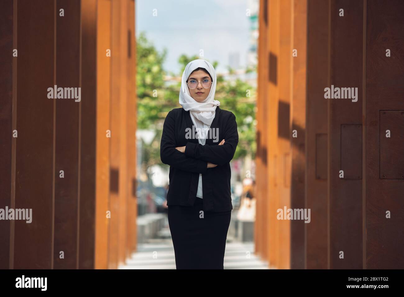 Hands crossed. Beautiful muslim successful businesswoman portrait ...
