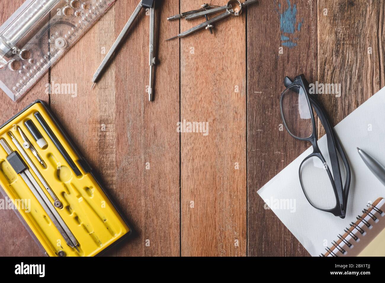 Top view of engineering tools with paper,pen and glasses on wooden ...