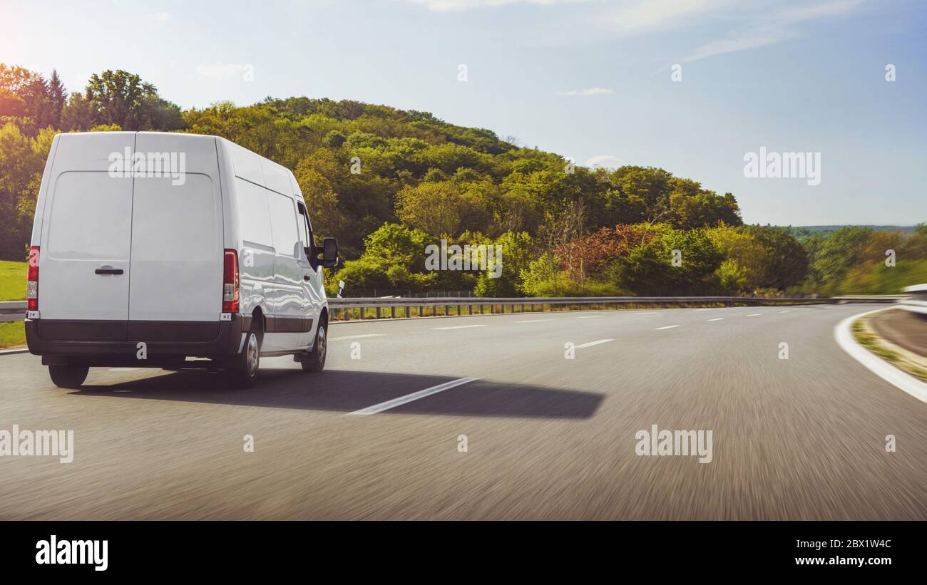 A delivery bus on the street Stock Photo - Alamy