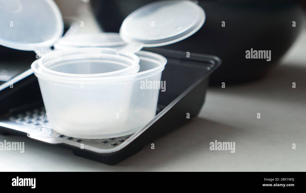 Empty plastic containers for sushi set delivery. Take away lunch box ...