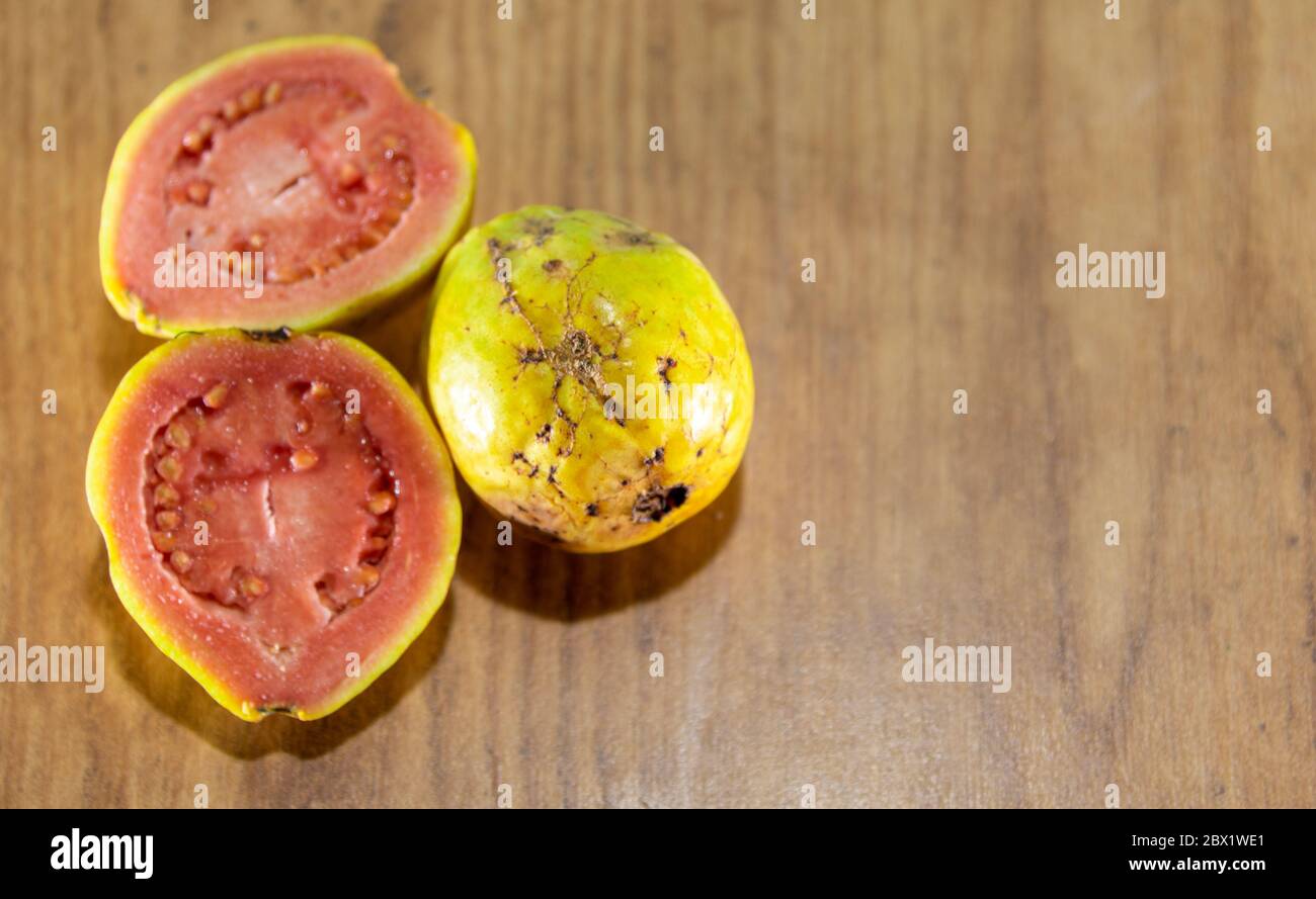 Guava fruits (Psidium guajava L.). Guava is a small tropical fruit tree ...